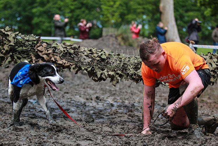 Runners and pooches slog their way through Battersea’s Muddy Dog ...