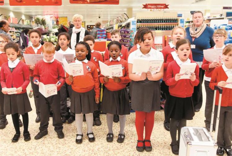 Pupils sing carols to shoppers in Dedworth Tesco - Photo 1 of 1 ...